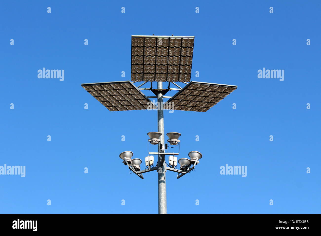 Light grey strong metal pole holding modern LED street light reflectors ...