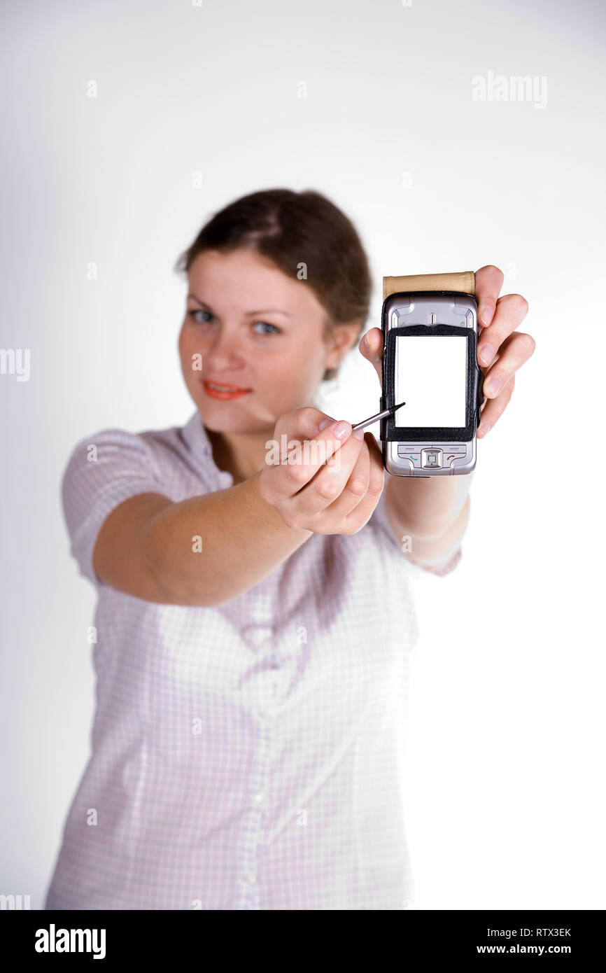pretty girl with a smartphone on white and grey background Stock Photo ...