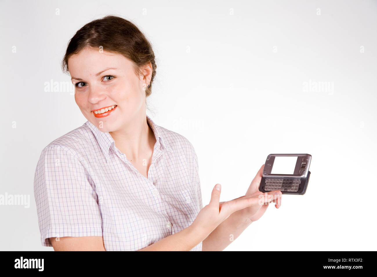 pretty girl with a smartphone on white and grey background Stock Photo ...