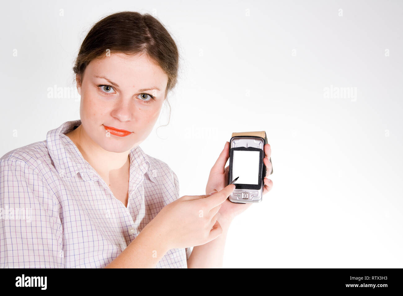 pretty girl with a smartphone on white and grey background Stock Photo ...