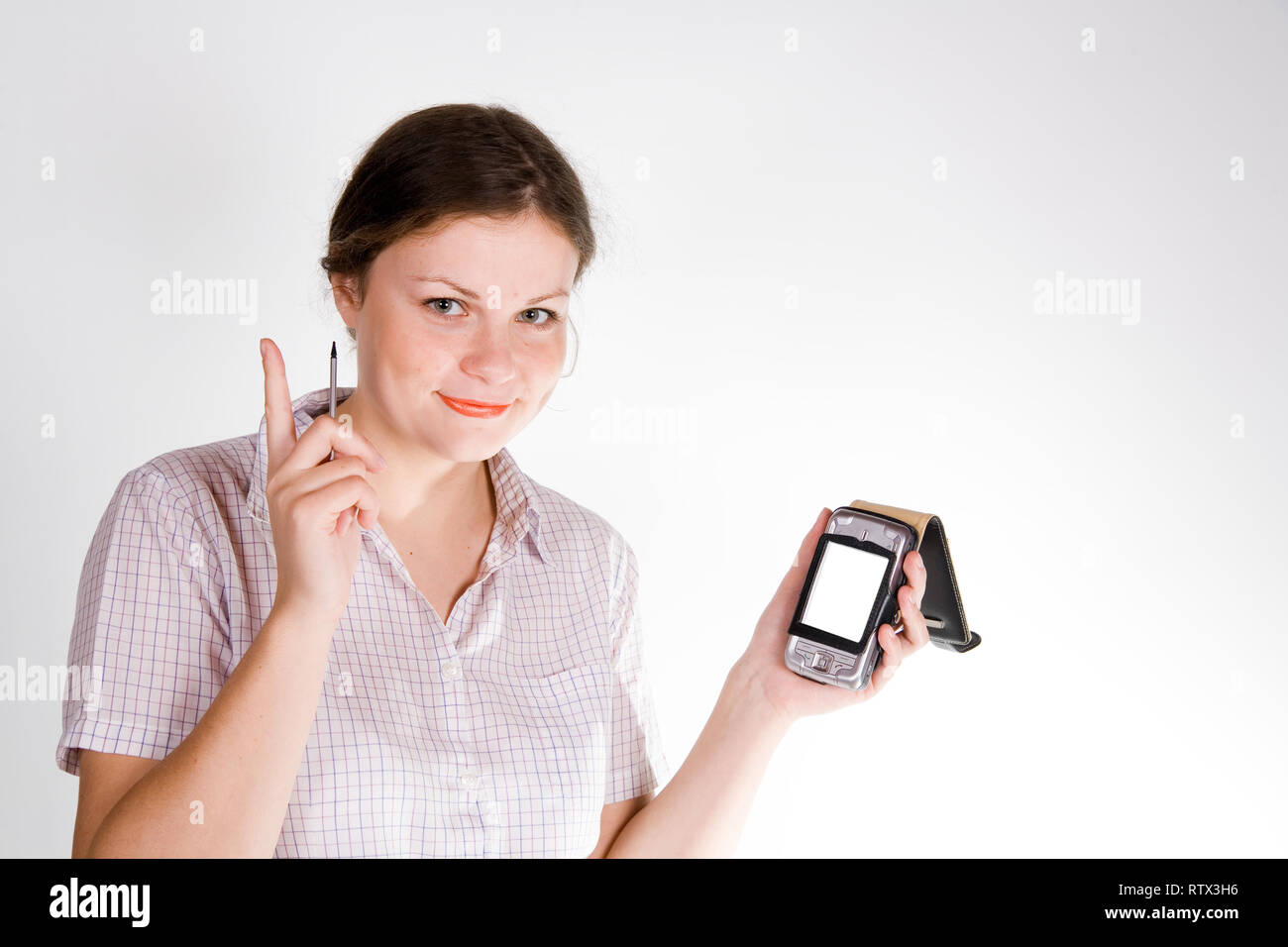 pretty girl with a smartphone on white and grey background Stock Photo ...