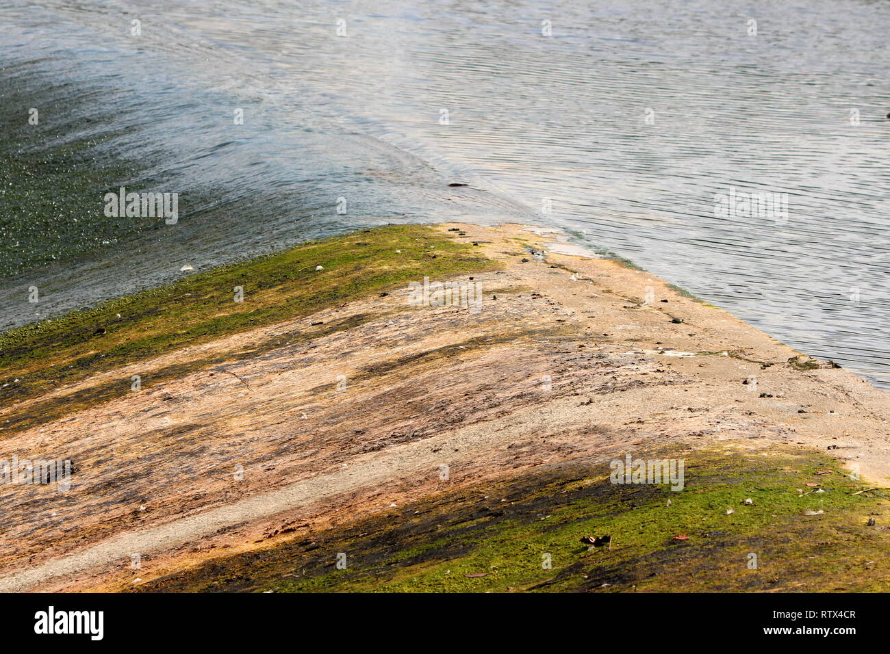 Partially dried man made waterfall during summer low water levels and ...