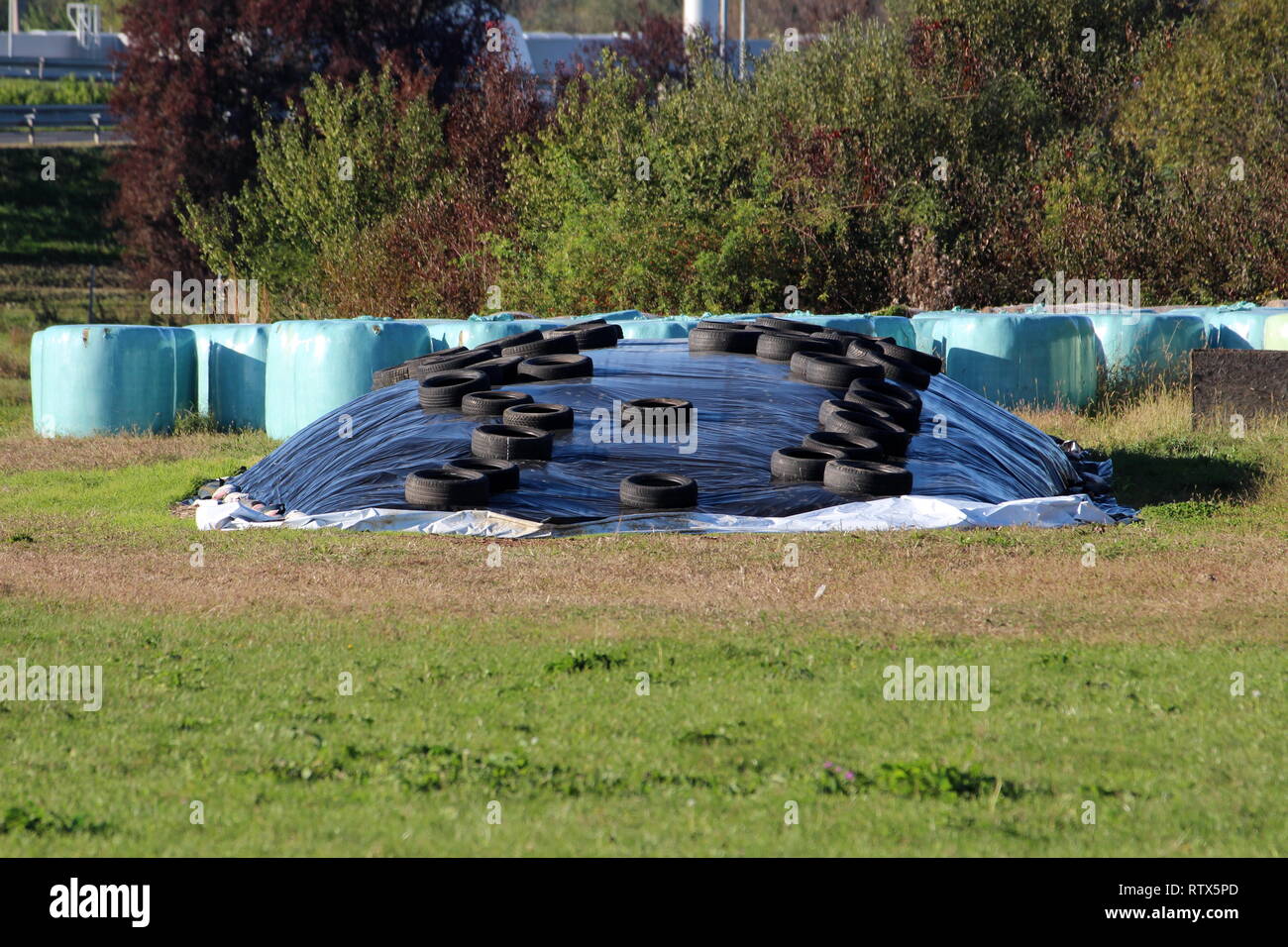 Black plastic covered hay bales hi-res stock photography and images - Alamy