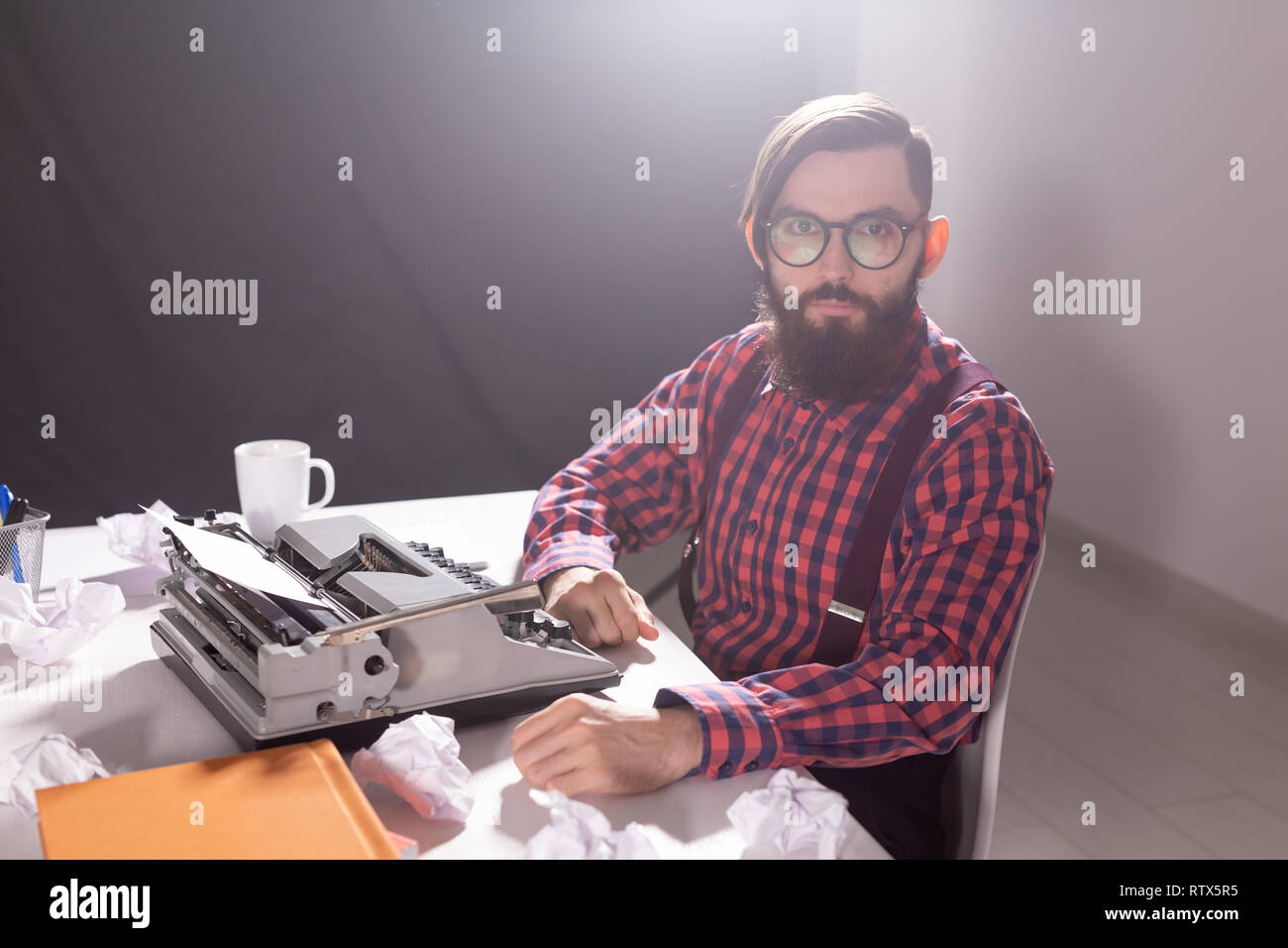 people, writer and hipster concept - young stylish writer working on ...