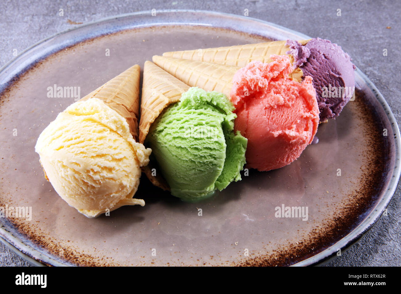 Set of ice cream scoops of different colors and flavours with berries ...