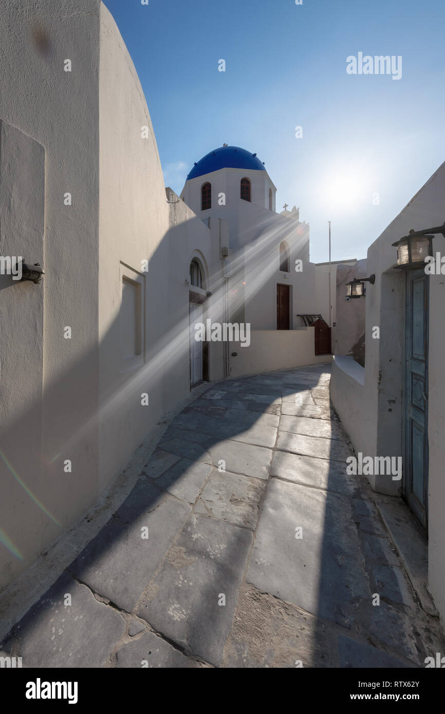 Santorini street at sunset Stock Photo - Alamy