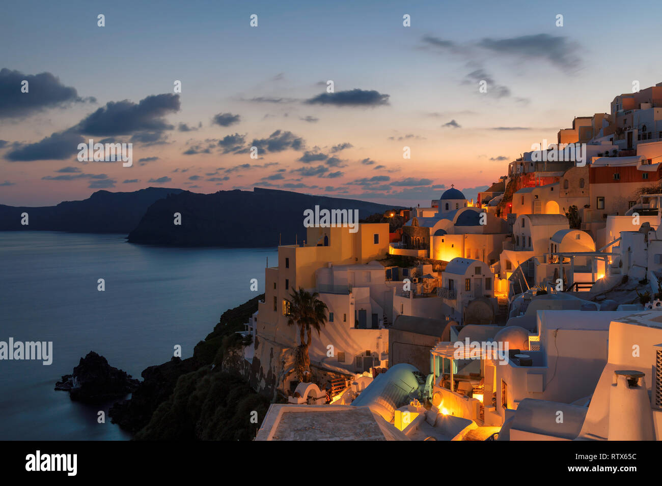 Santorini island at night Stock Photo - Alamy