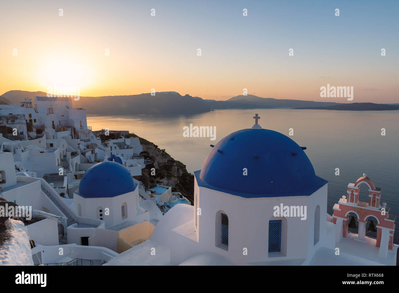 Spectacular Oia town at sunrise on Santorini island, Greece Stock Photo ...