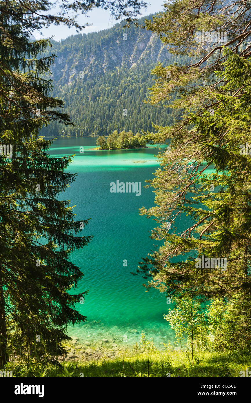Lake Eibsee with turquoise color and some islands near the Wetterstein ...