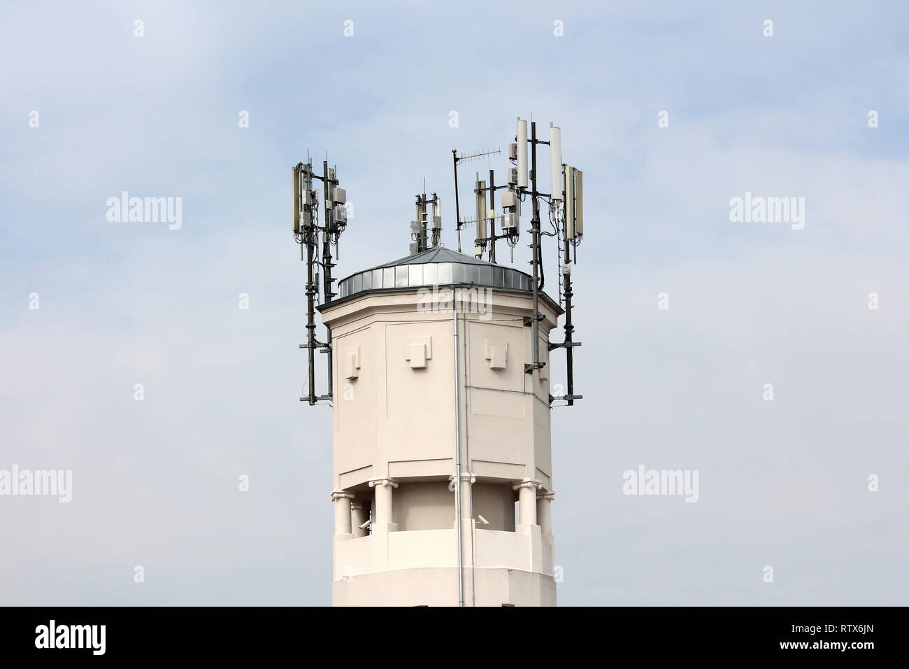 Top of large concrete industrial complex tower with multiple cell phone ...