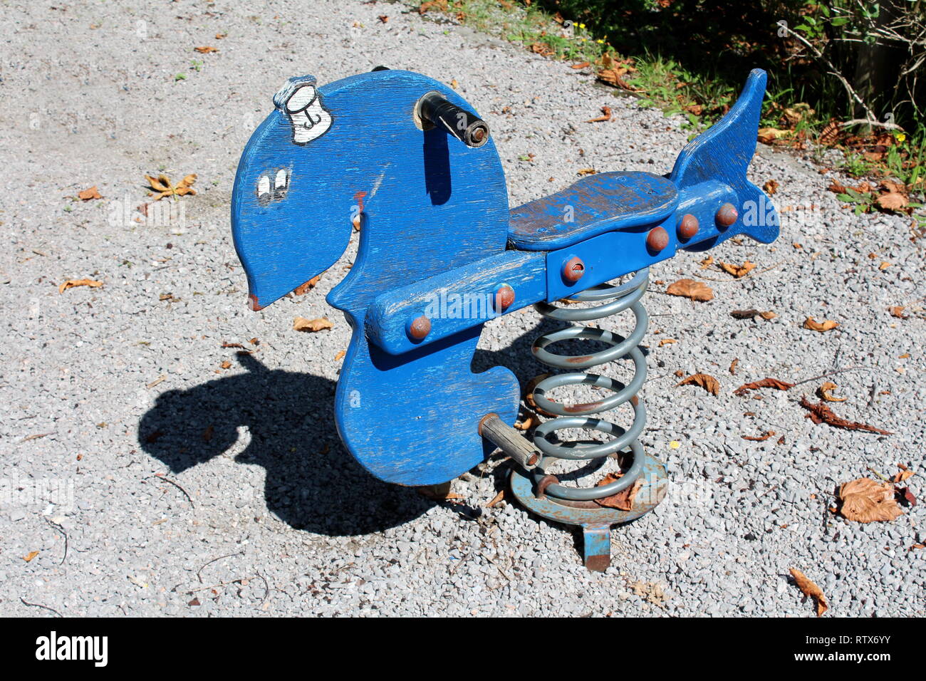 Vintage retro old outdoor public playground equipment in shape of pony ...