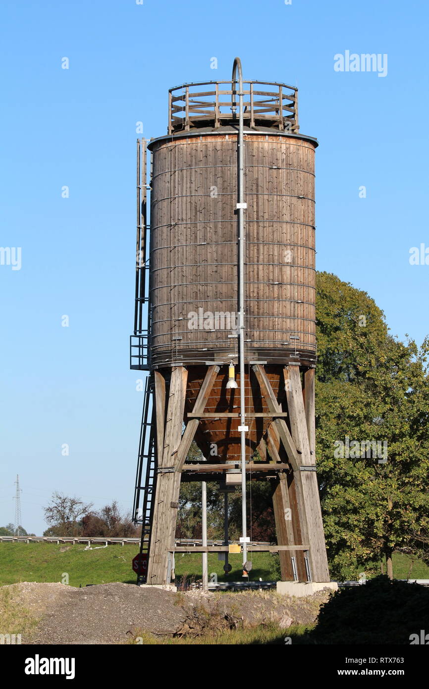 Wooden storage silo on strong wooden support beams and concrete ...