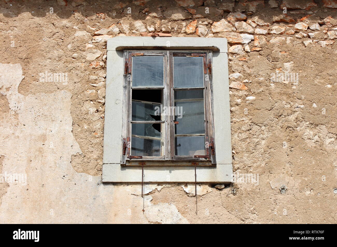Wooden window on abandoned house with broken glass mounted on cracked ...