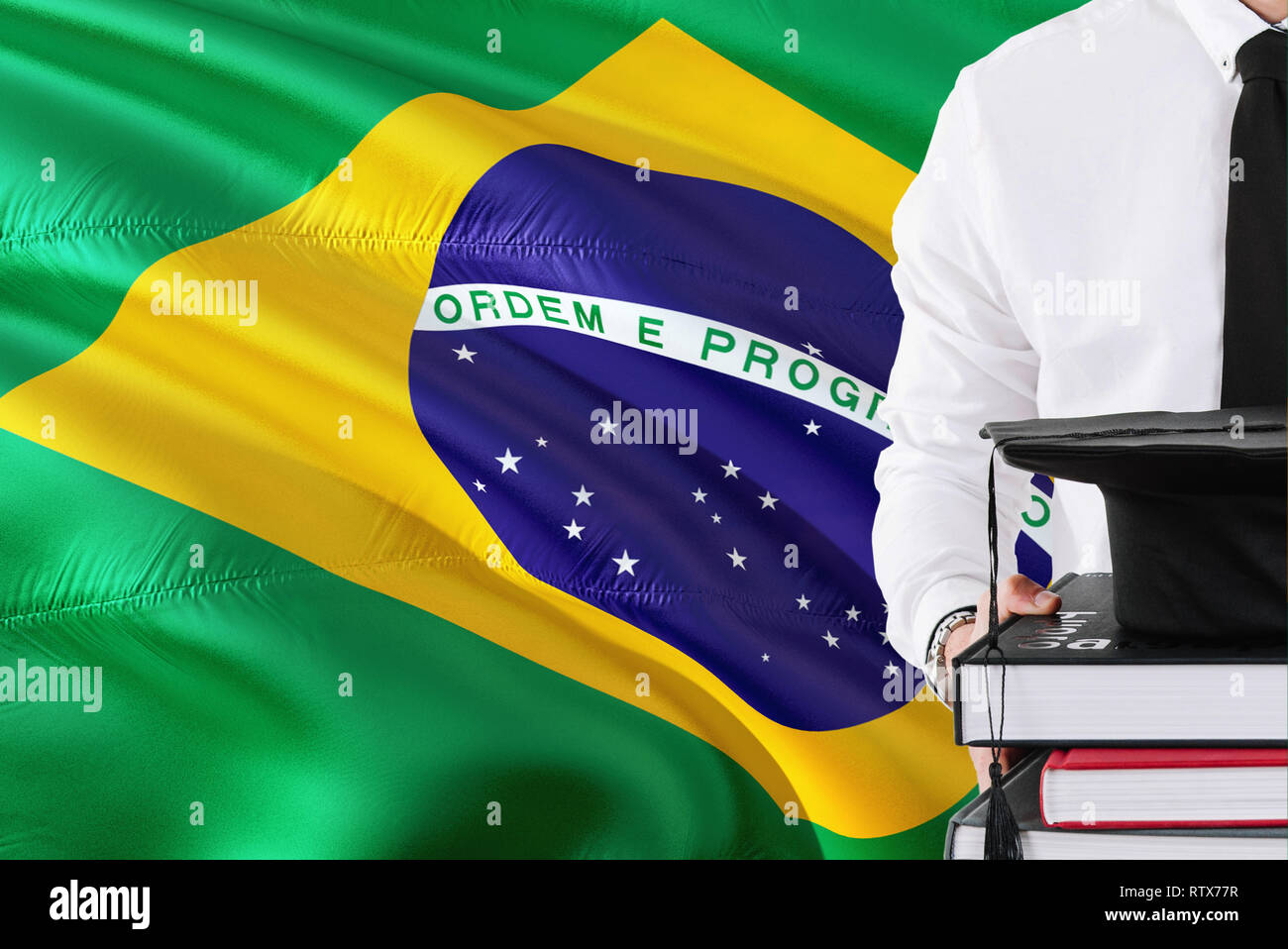 Successful Brazilian student education concept. Holding books and ...