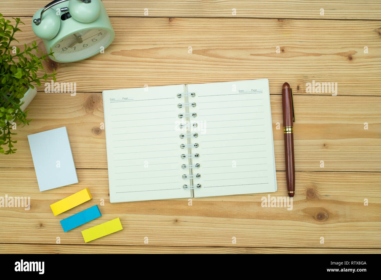 Office supplies or office work essential tools items on wooden desk in ...