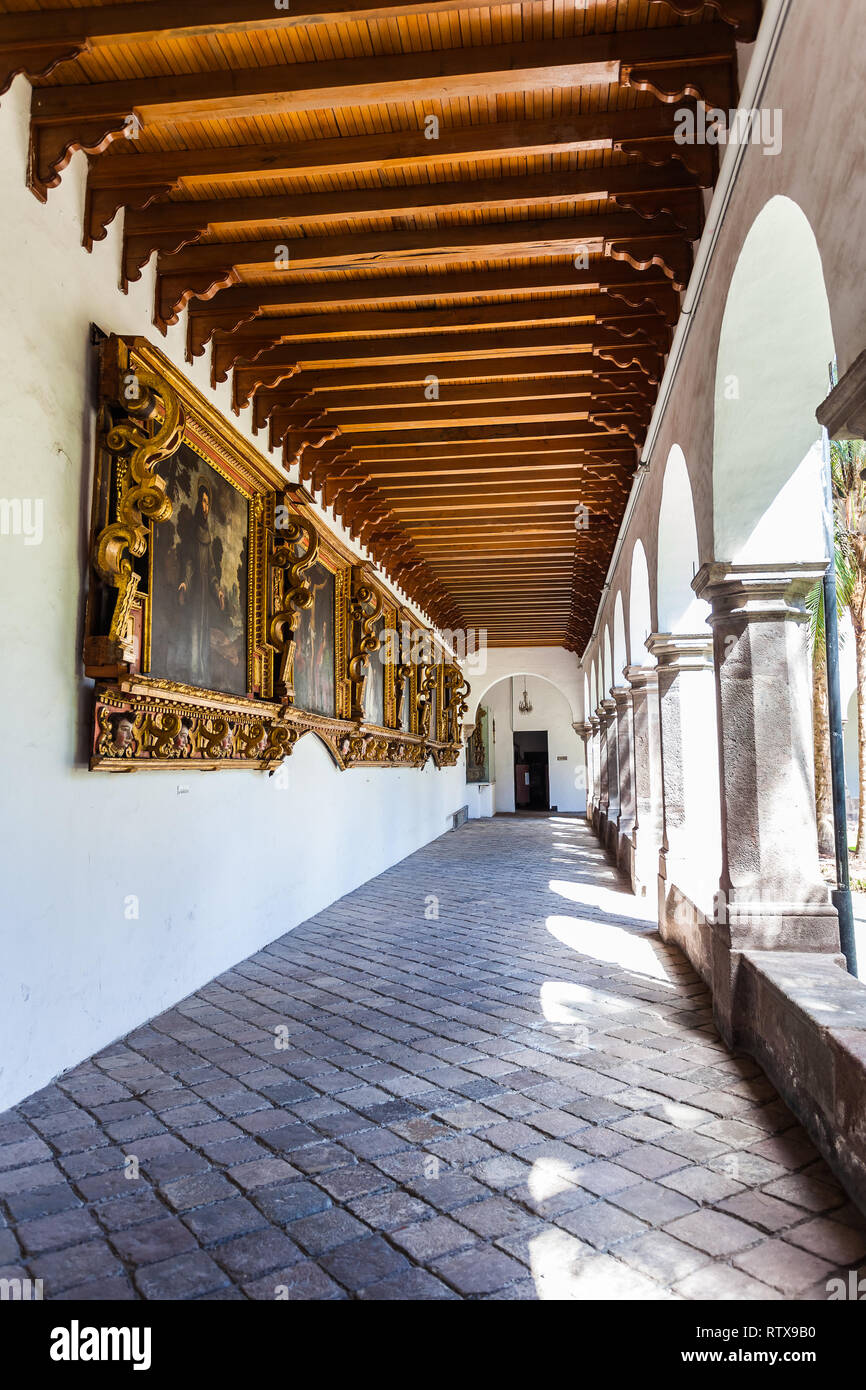 Quito, Ecuador, July 2018: Hallways of the inner courtyard of the Santo ...