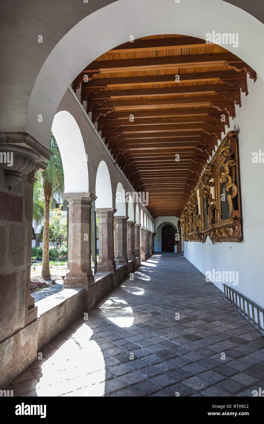 Quito, Ecuador, July 2018: Hallways of the inner courtyard of the Santo ...