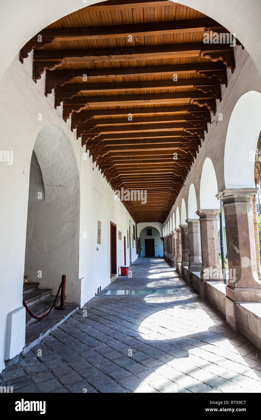 Quito, Ecuador, July 2018: Hallways of the inner courtyard of the Santo ...