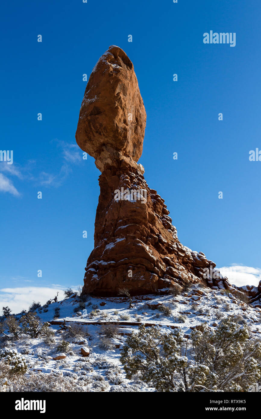 Balanced Rock in Arches National Park early winter with lots of snow on ...