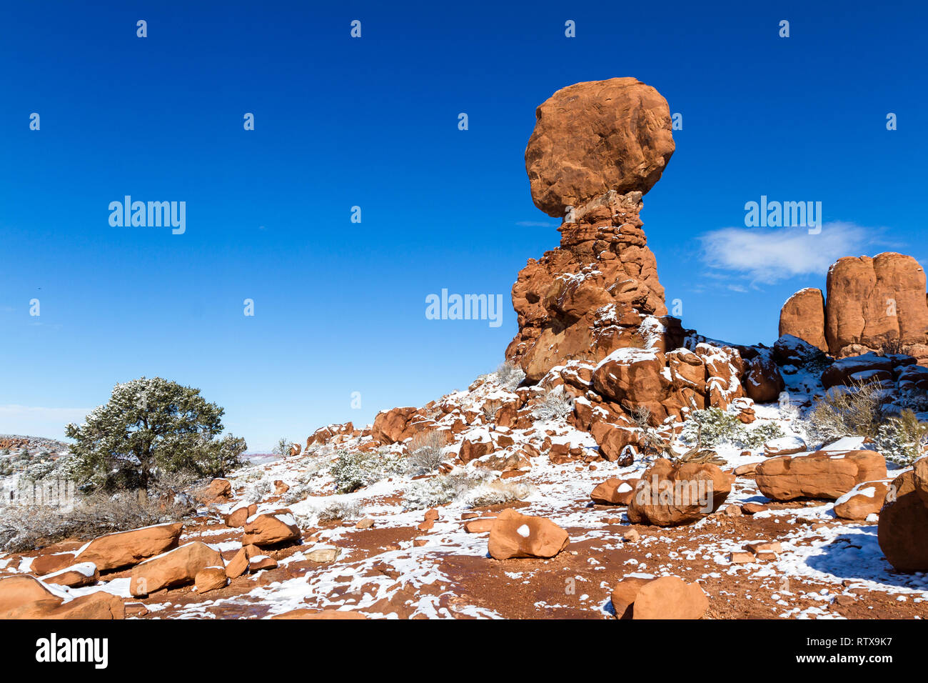 Balanced Rock in Arches National Park early winter with lots of snow on ...