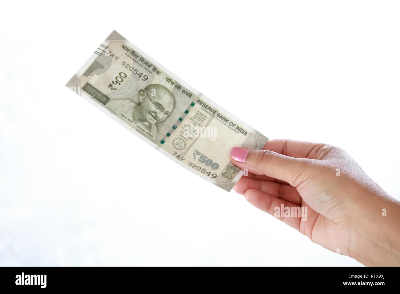 Hand holding five notes hi-res stock photography and images - Alamy
