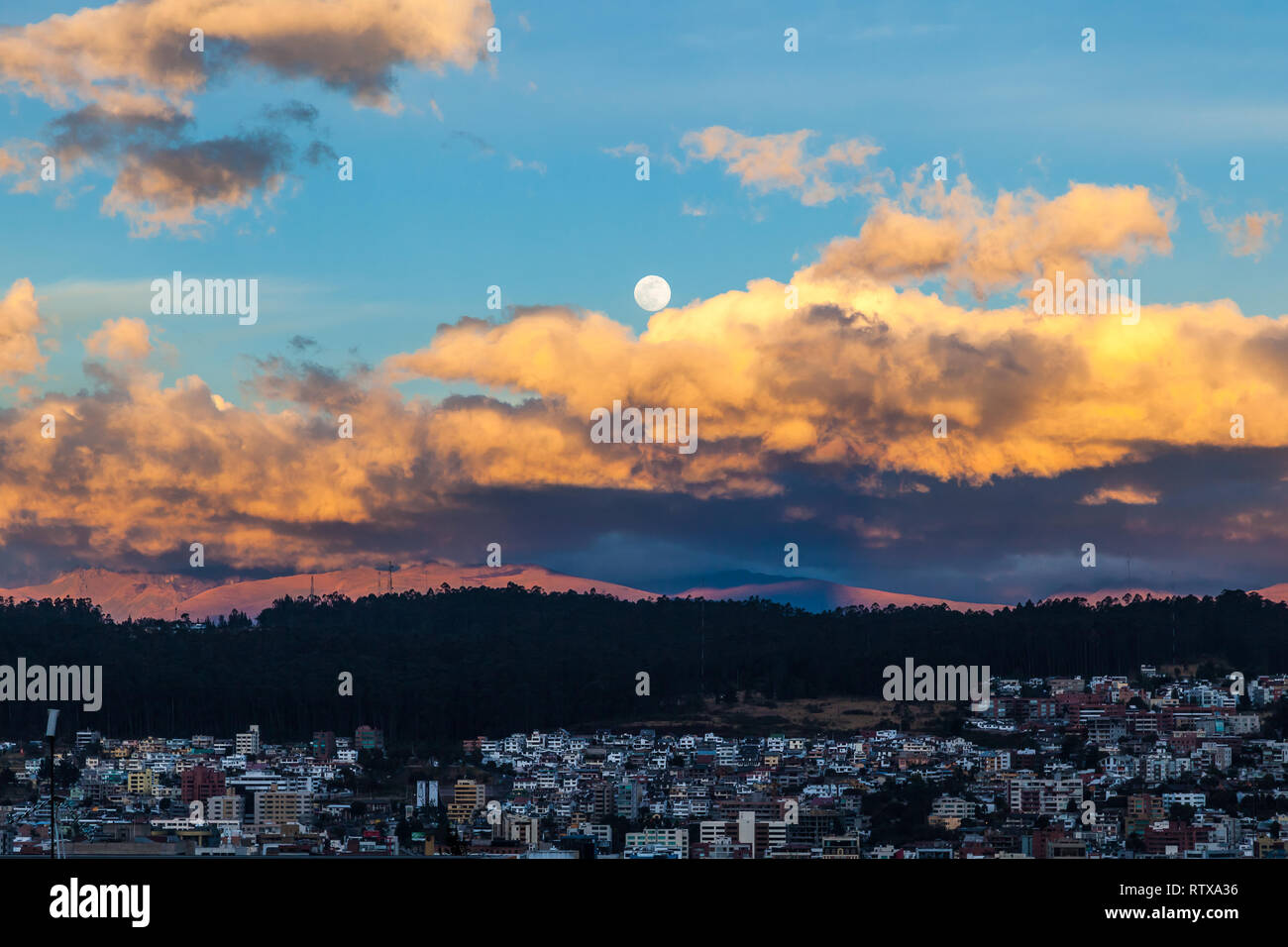 Sunset with blue sky and dramatic pink, orange, yellow, blue clouds and ...