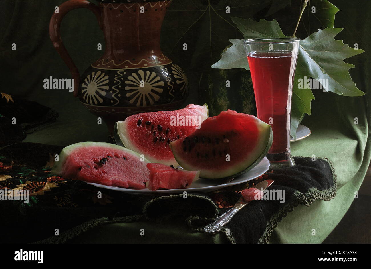 Still life with watermelon on a wooden table Stock Photo - Alamy