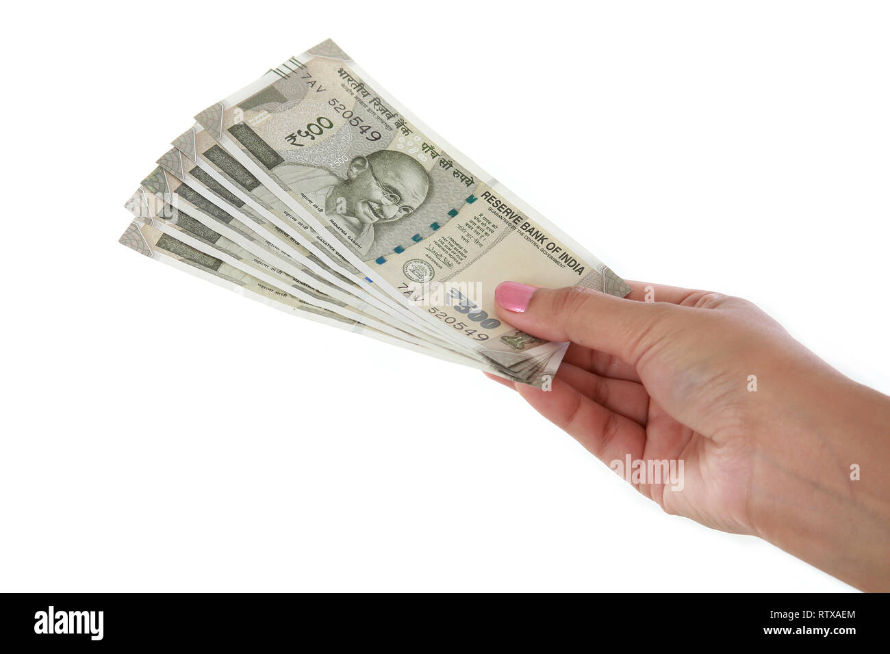 Hand holding indian rupee notes hi-res stock photography and images - Alamy