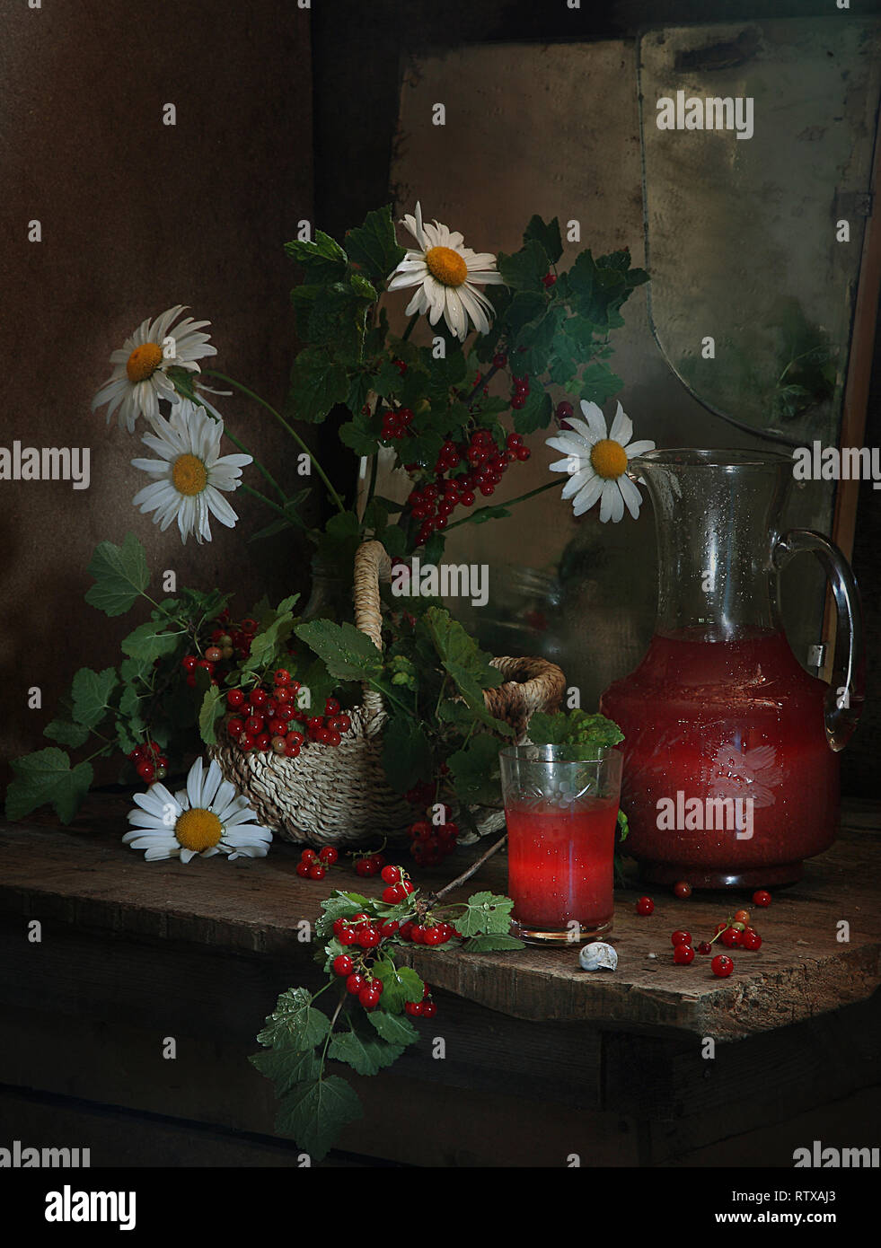 Compote of red currant and a bouquet of country flowers Stock Photo - Alamy