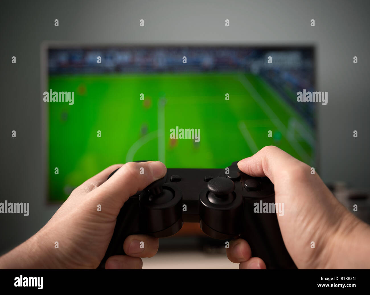 Football game with game console, game concept Stock Photo - Alamy