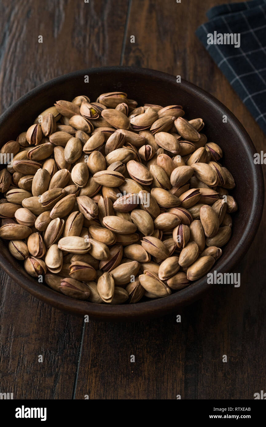 Pistachio Nuts with Shell in Wooden Bowl. Organic Snacks Stock Photo ...