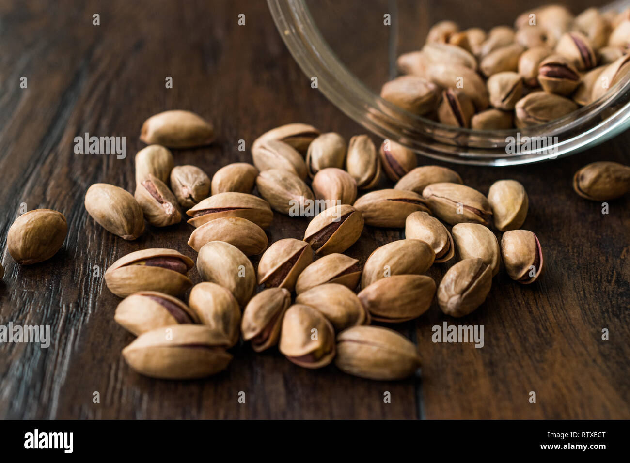 Pistachio Nuts with Shell on Dark Wooden Surface. Organic Snacks Stock ...