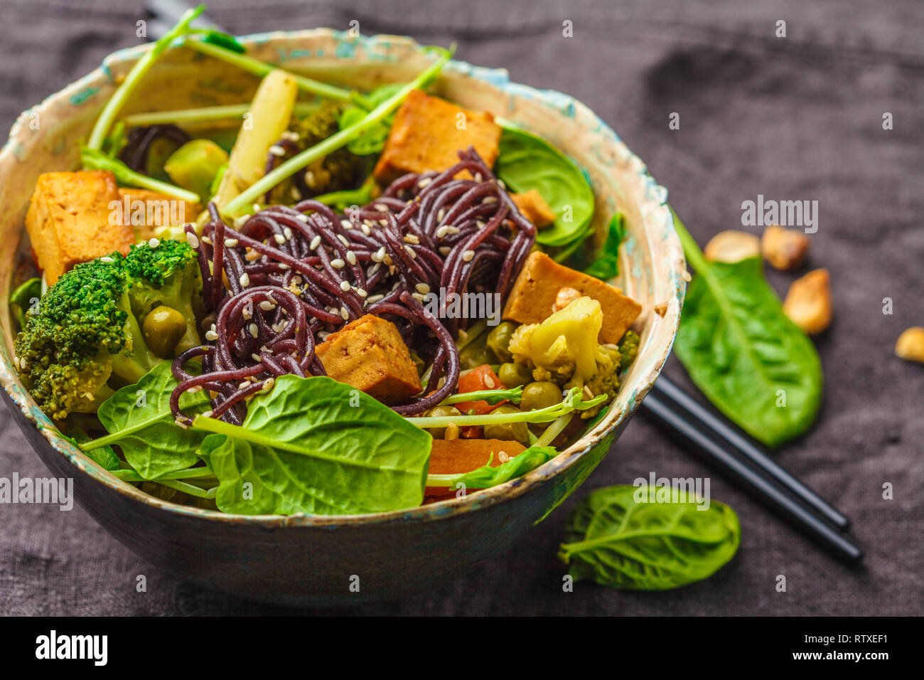 Asian vegan stir fry with tofu, rice noodles and vegetables Stock Photo ...