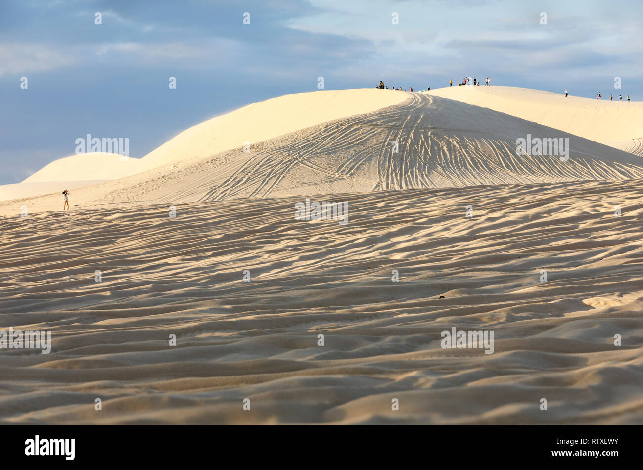 MUI NE, VIETNAM - FEBRUARY 17, 2018: Tourist walk on yellow sand dunes ...