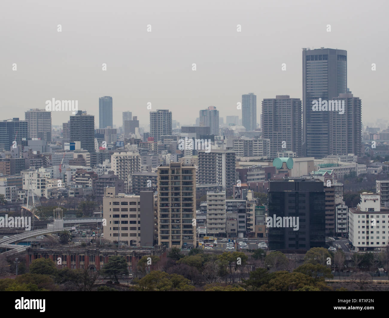 Buildings in downtown Osaka on a cloudy day Stock Photo - Alamy