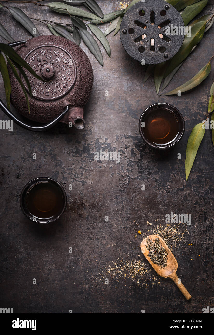 Tea background. Traditional Asian green tea set with teapot and cups on ...