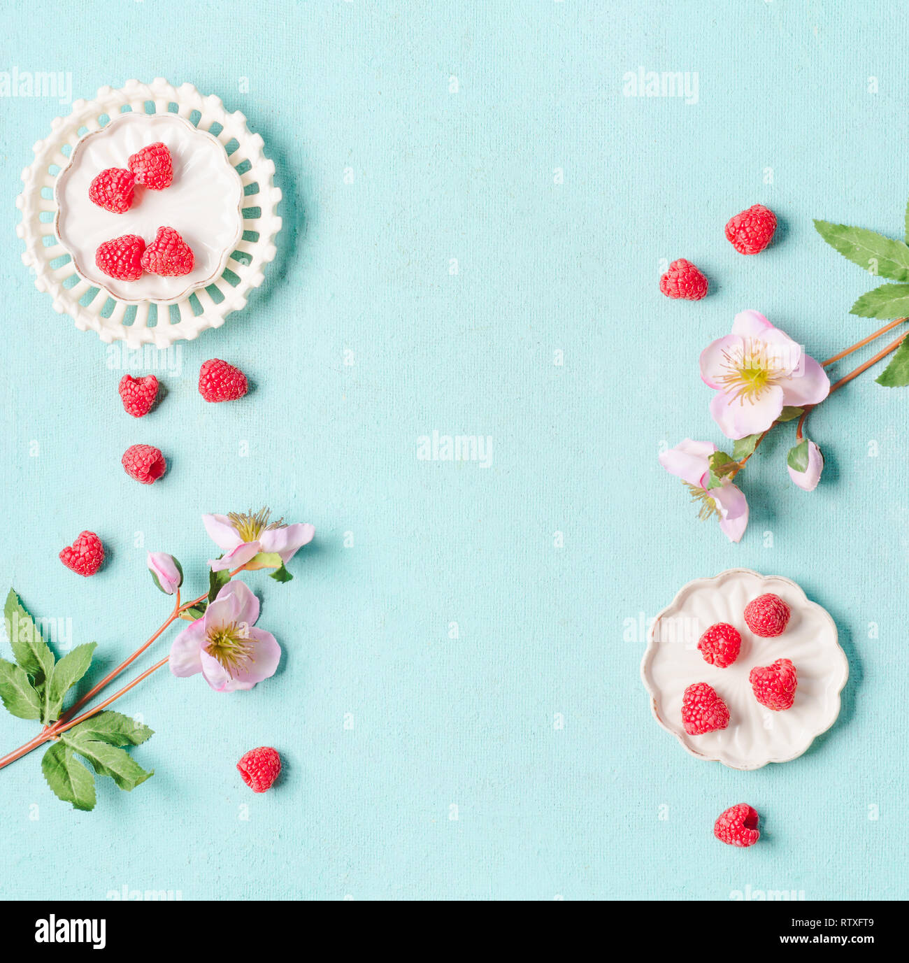 Food background with fresh raspberries in white bowls on light ...