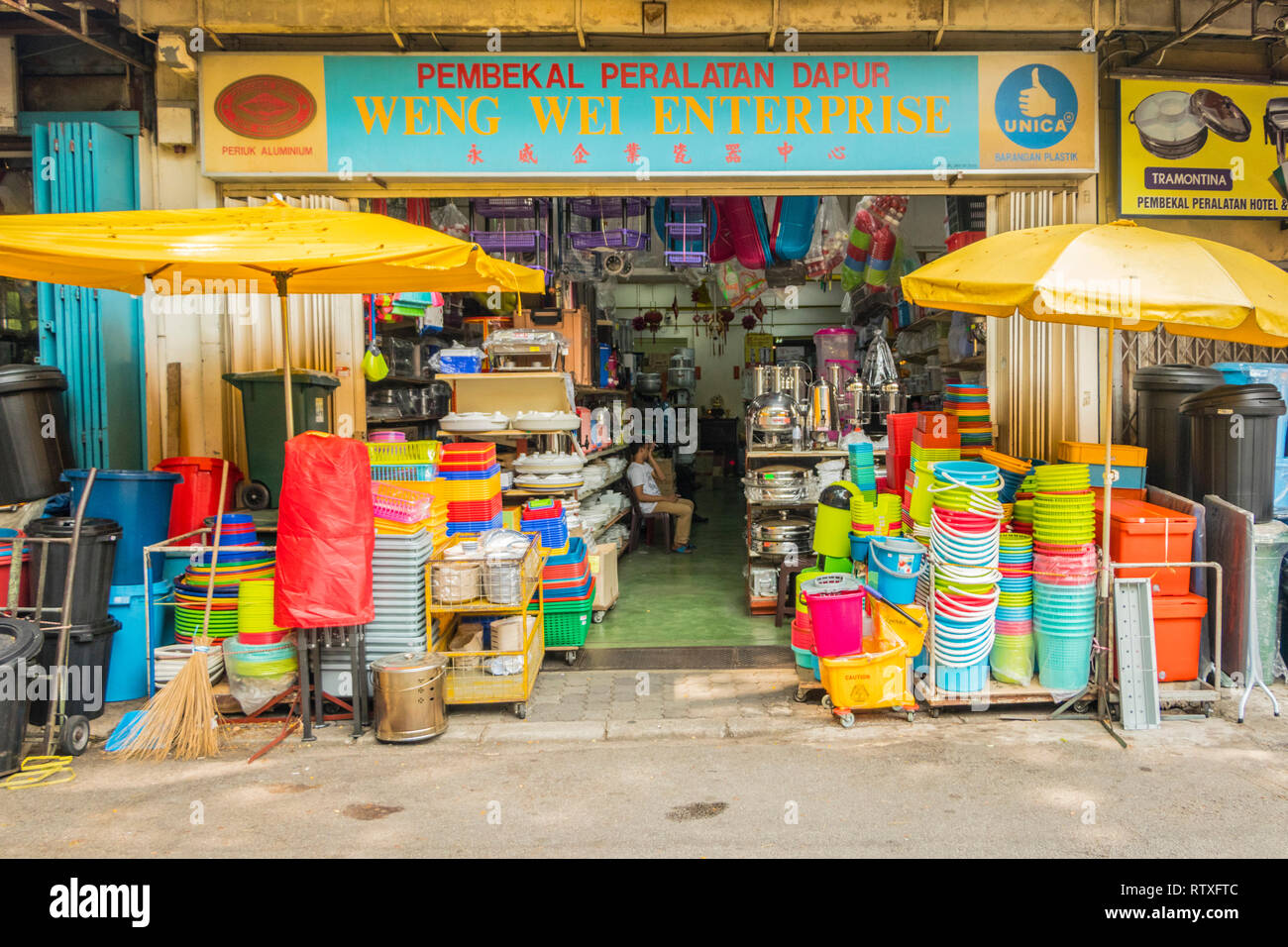 traditional goods store selling colourful plastic buckets in street in ...