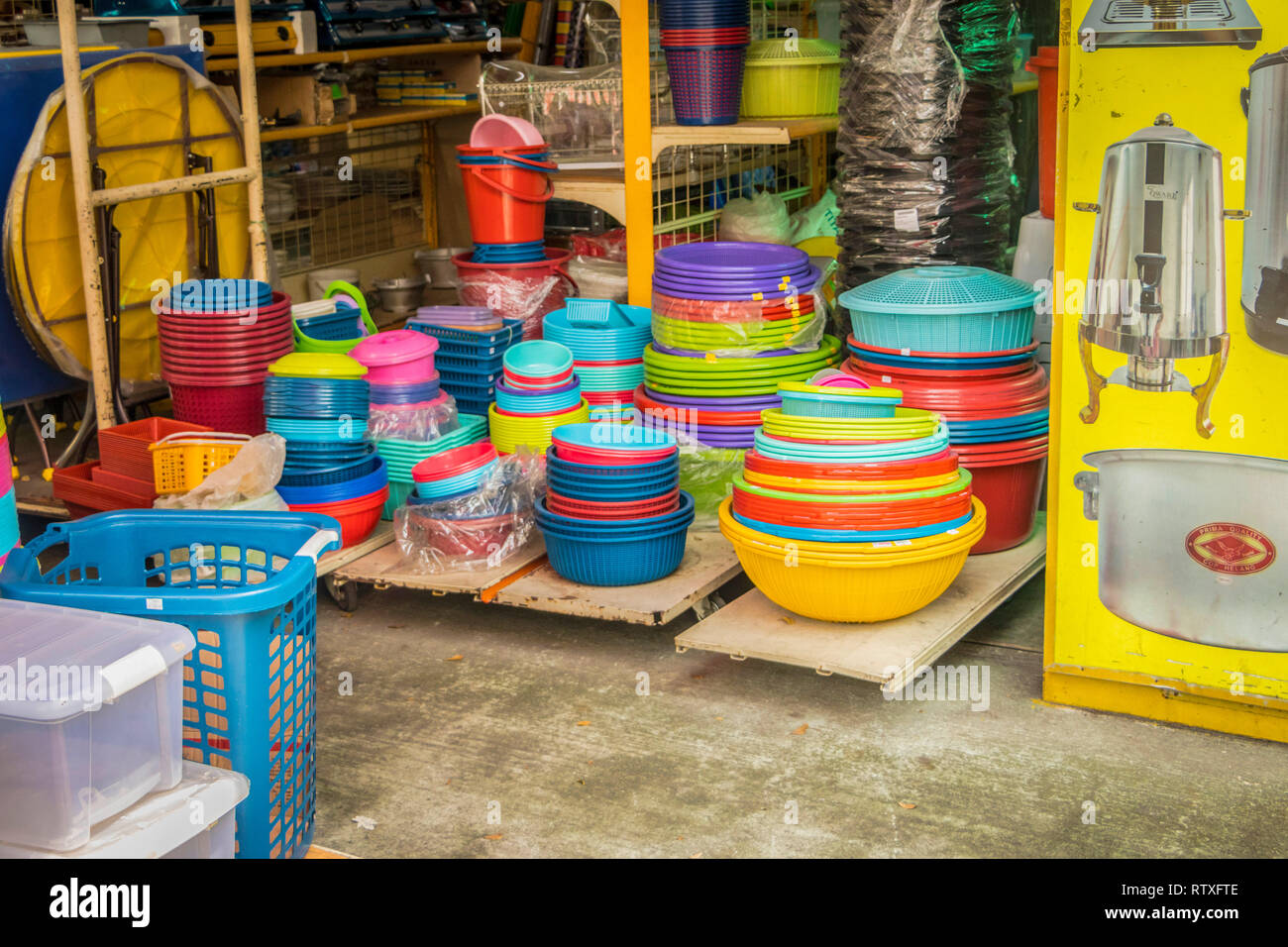 traditional goods store selling colourful plastic buckets in street in ...