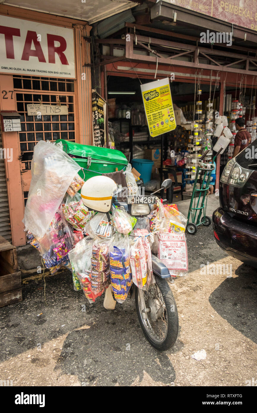 very overloaded motor scooter outside store in Kuala Lumpur Malaysia ...