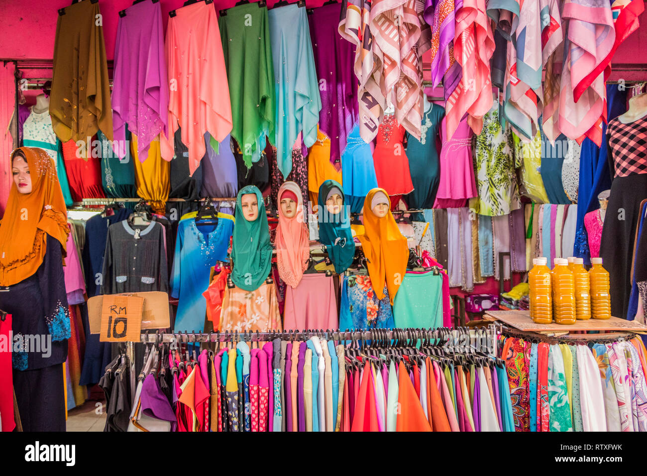 textile stall with muslim head wear and fabrics in Kuala Lumpur street ...