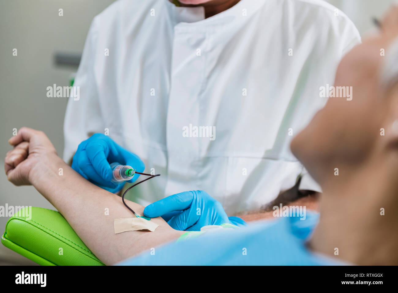 Drawing blood for platelet-rich plasma (PRP) treatment. Doctor drawing ...