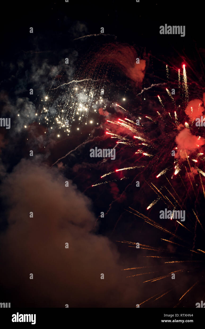 Red colorful Firework exploding in the sky for anniversary. Light show ...