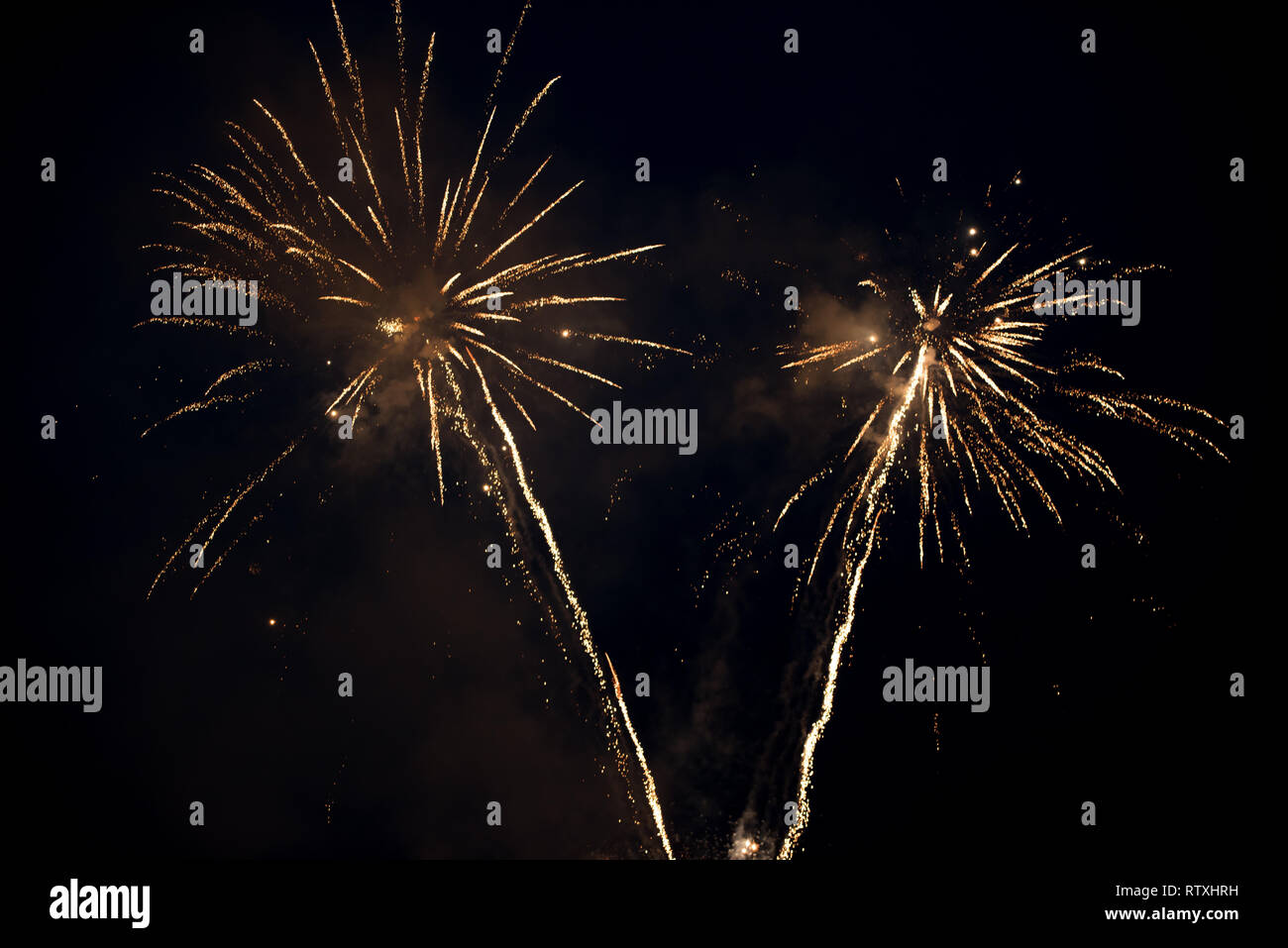 Two bright colorful fireworks explosion in the sky. Beautiful ...