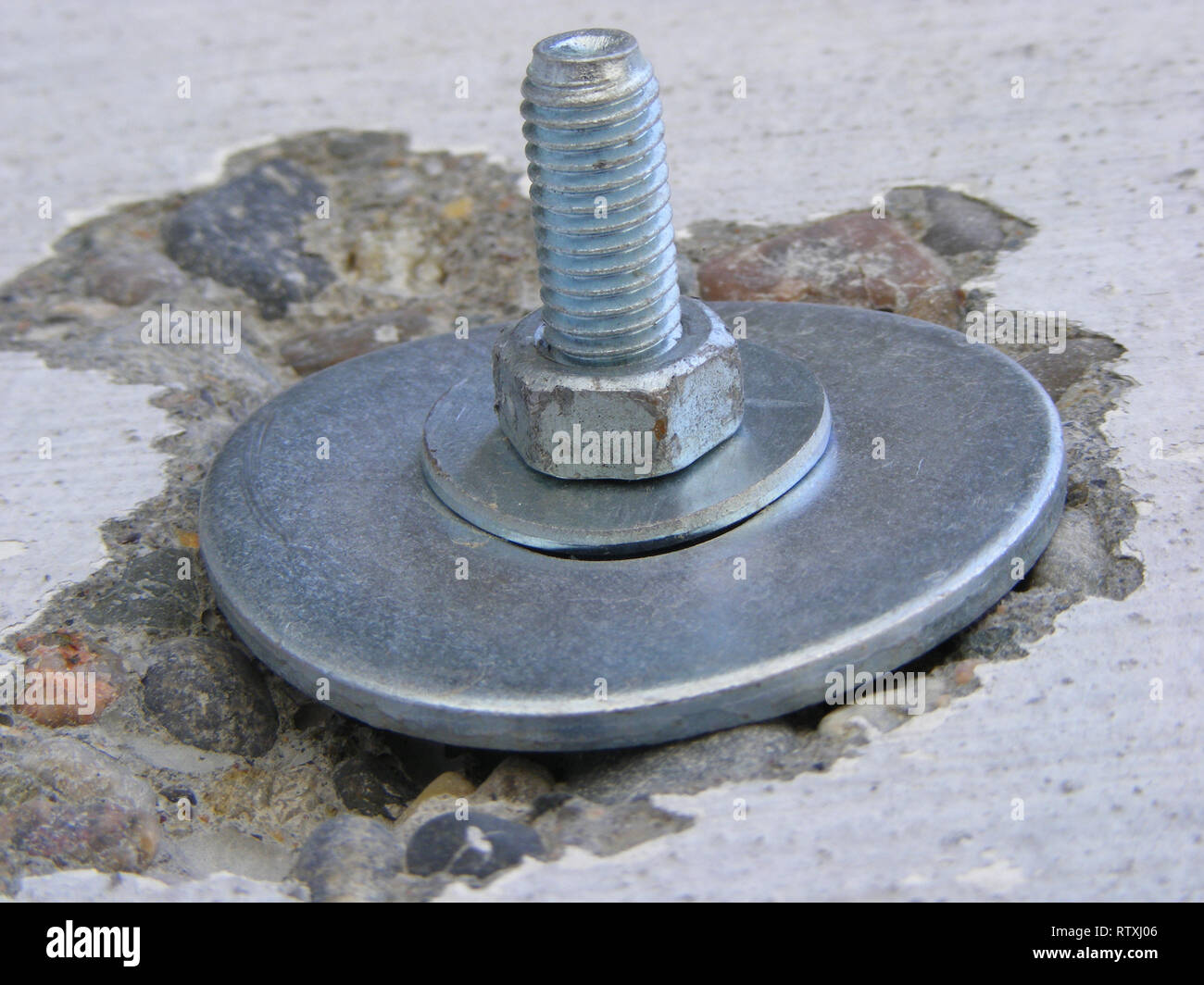 wall mounting with bolt, washer and nut Stock Photo - Alamy