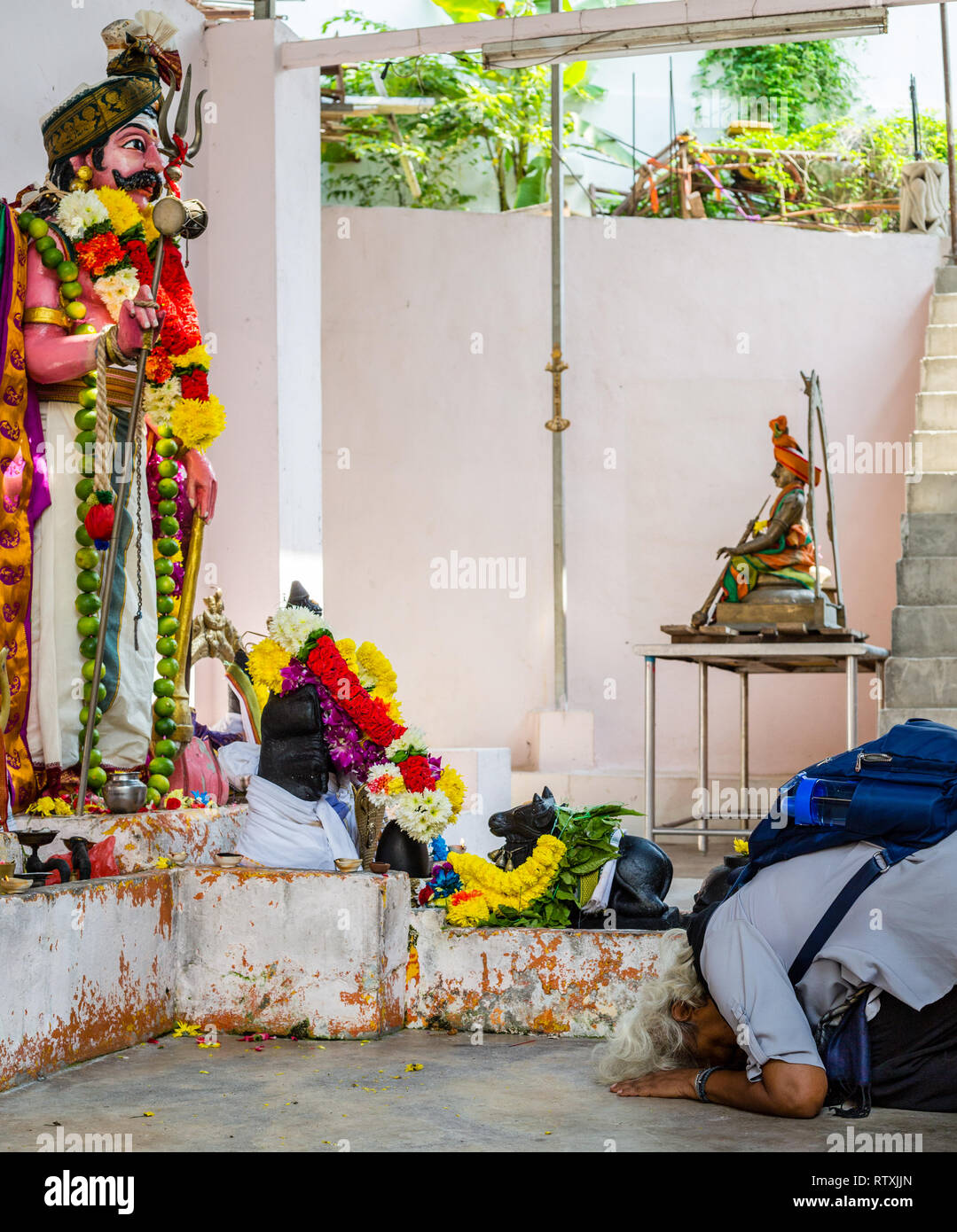 Worshiper Praying in front of Hindu Deity, Hindu Sri Maha Muneswarar ...