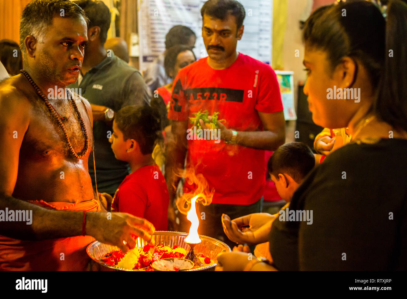 Hindu Priest and Worshiper Performing Ritual with Lamp, Sree Veera ...