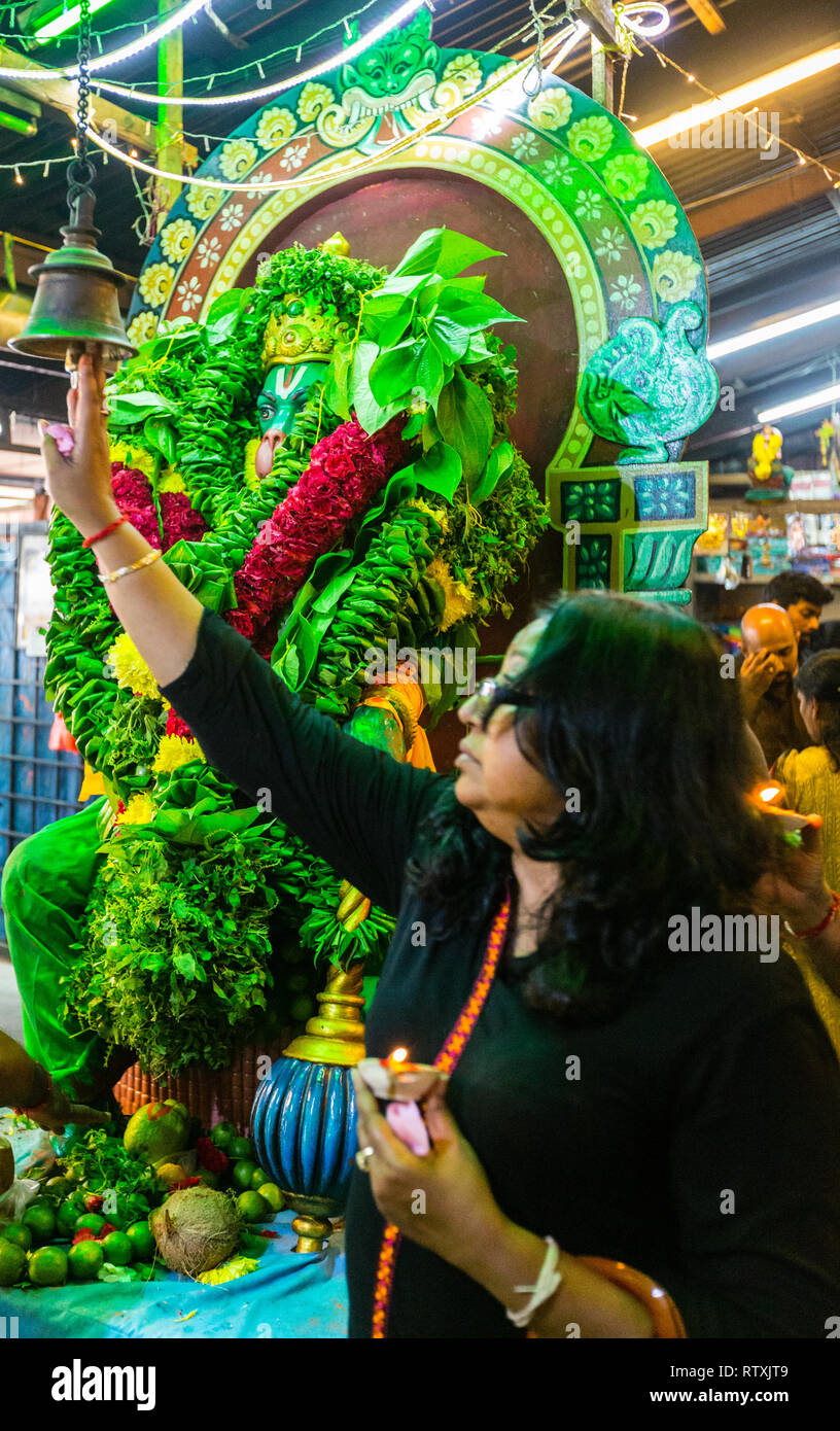 Worshiper Ringing Bell while Circumambulating Hanuman Shrine, Sree ...