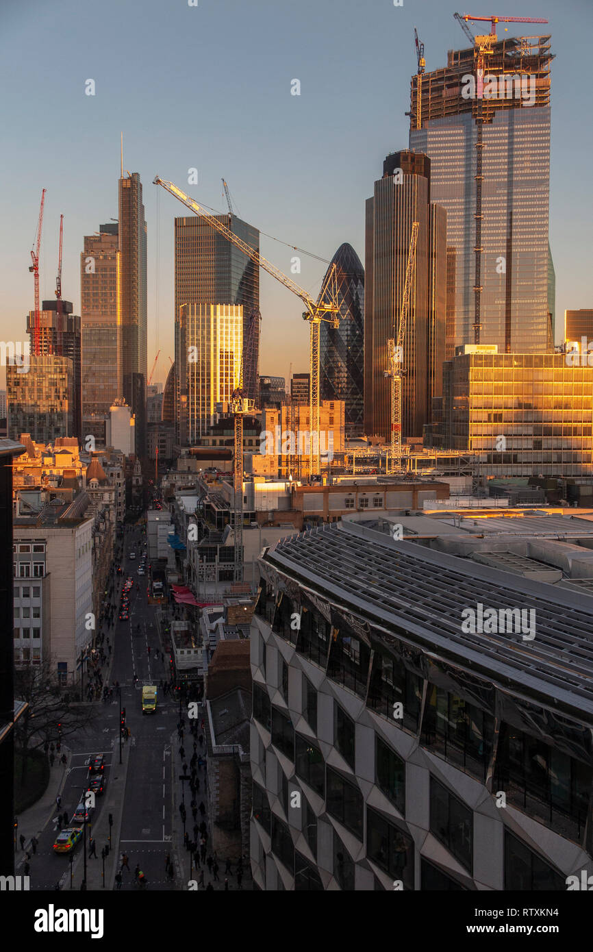 A dramatic City of London skyline with the high rise buildings bathed ...