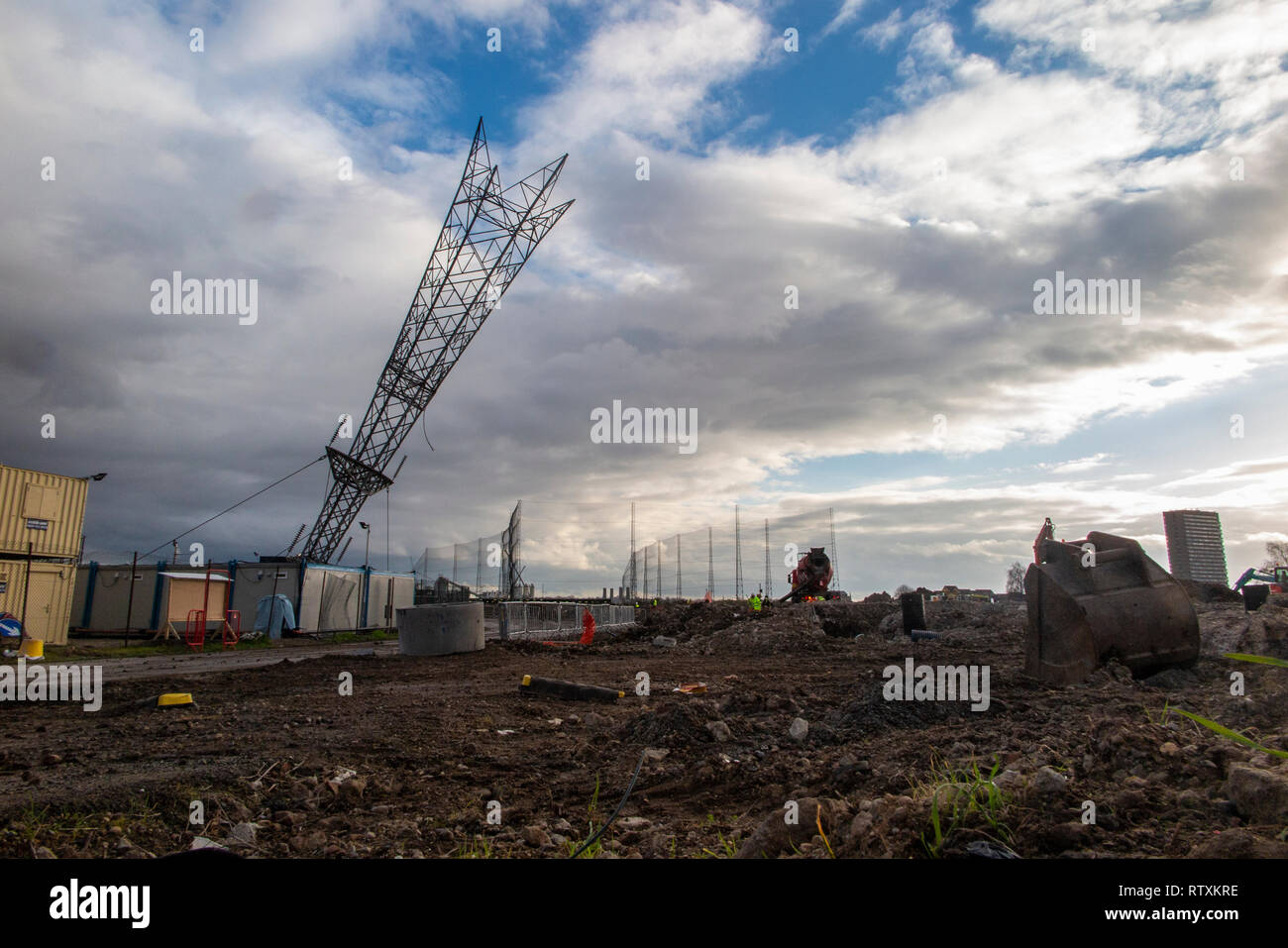 n electricity pylon appears to have dropped from the sky onto wasteland ...